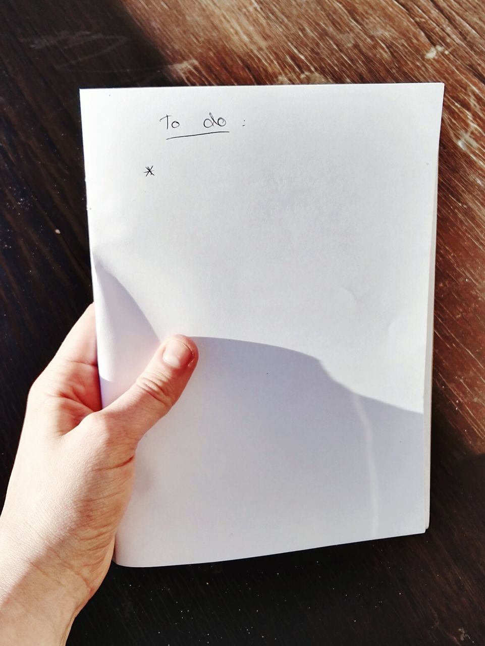 Cropped image of man holding paper | ID: 83013446