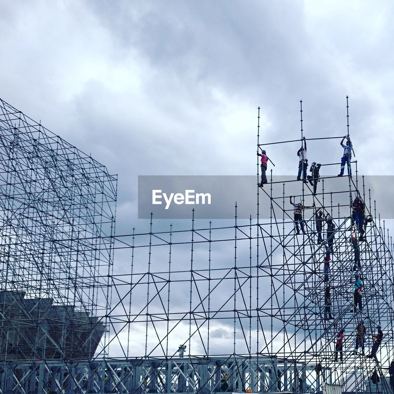 People on scaffolding at construction site | ID: 82599843