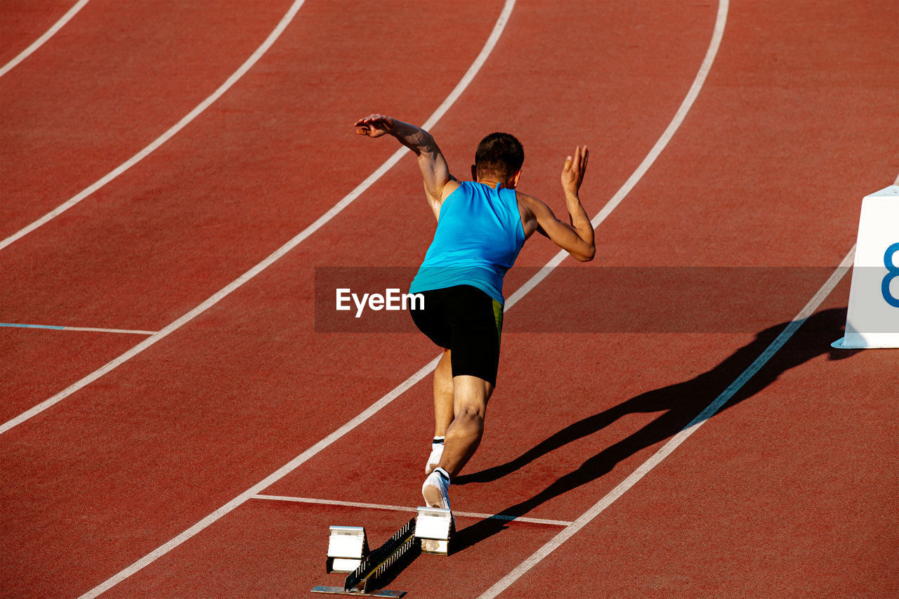 High angle view of man running on race track | ID: 161601546