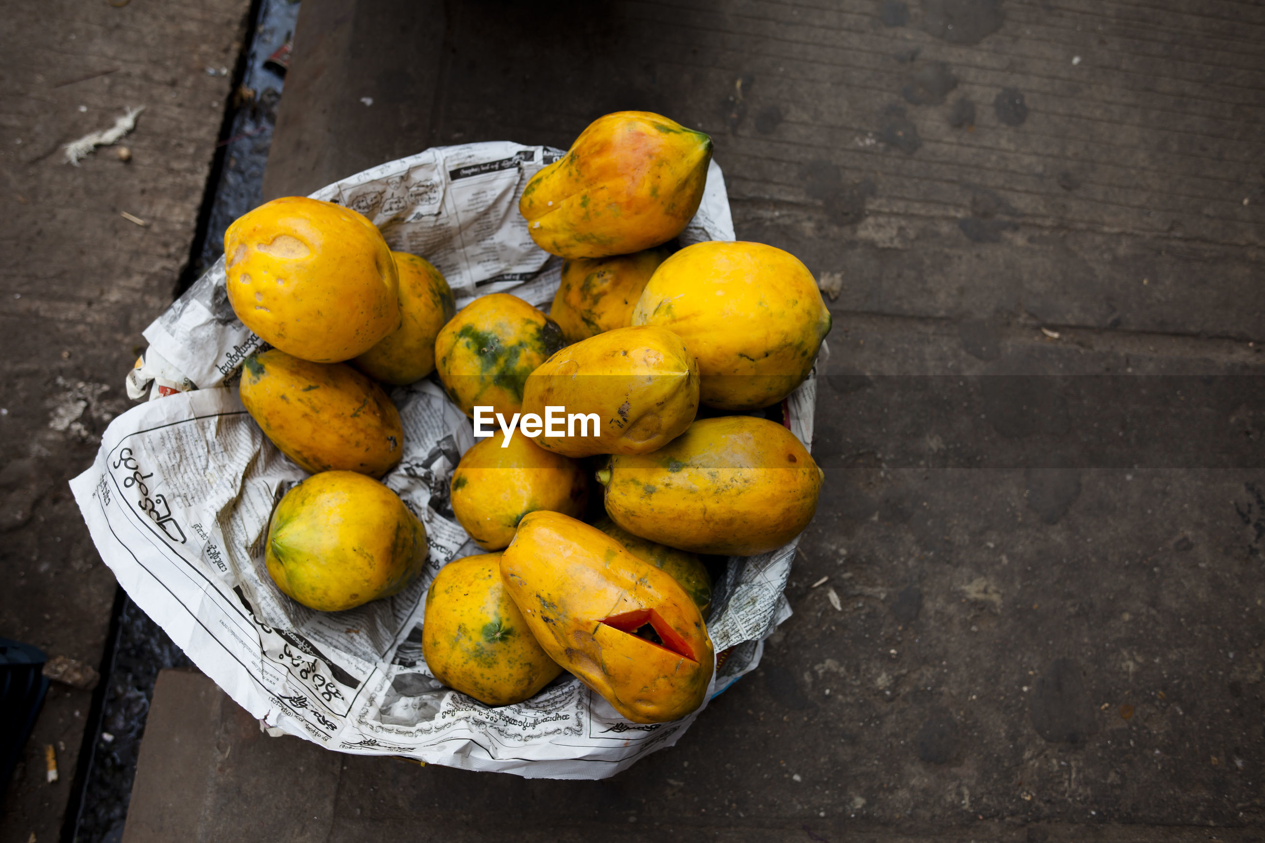 High angle view of papayas in basket at | ID: 92679220