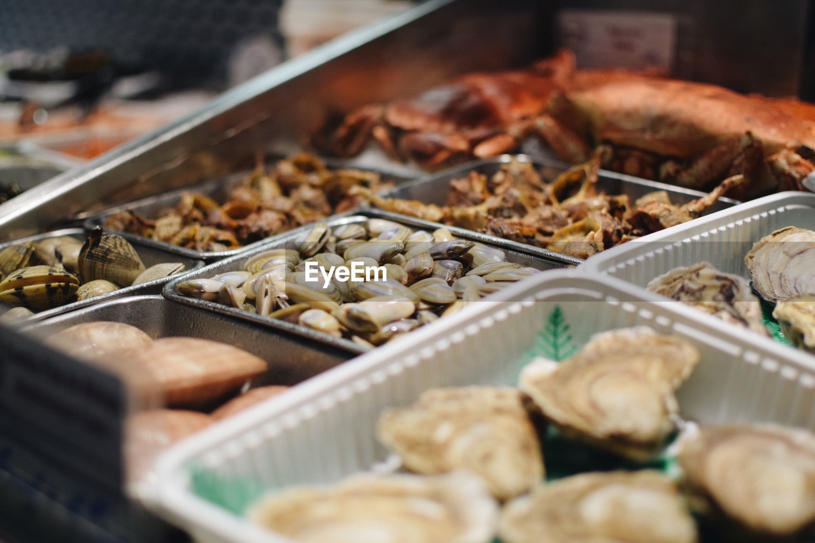 Close-up of fresh seafood in containers at | ID: 96433088