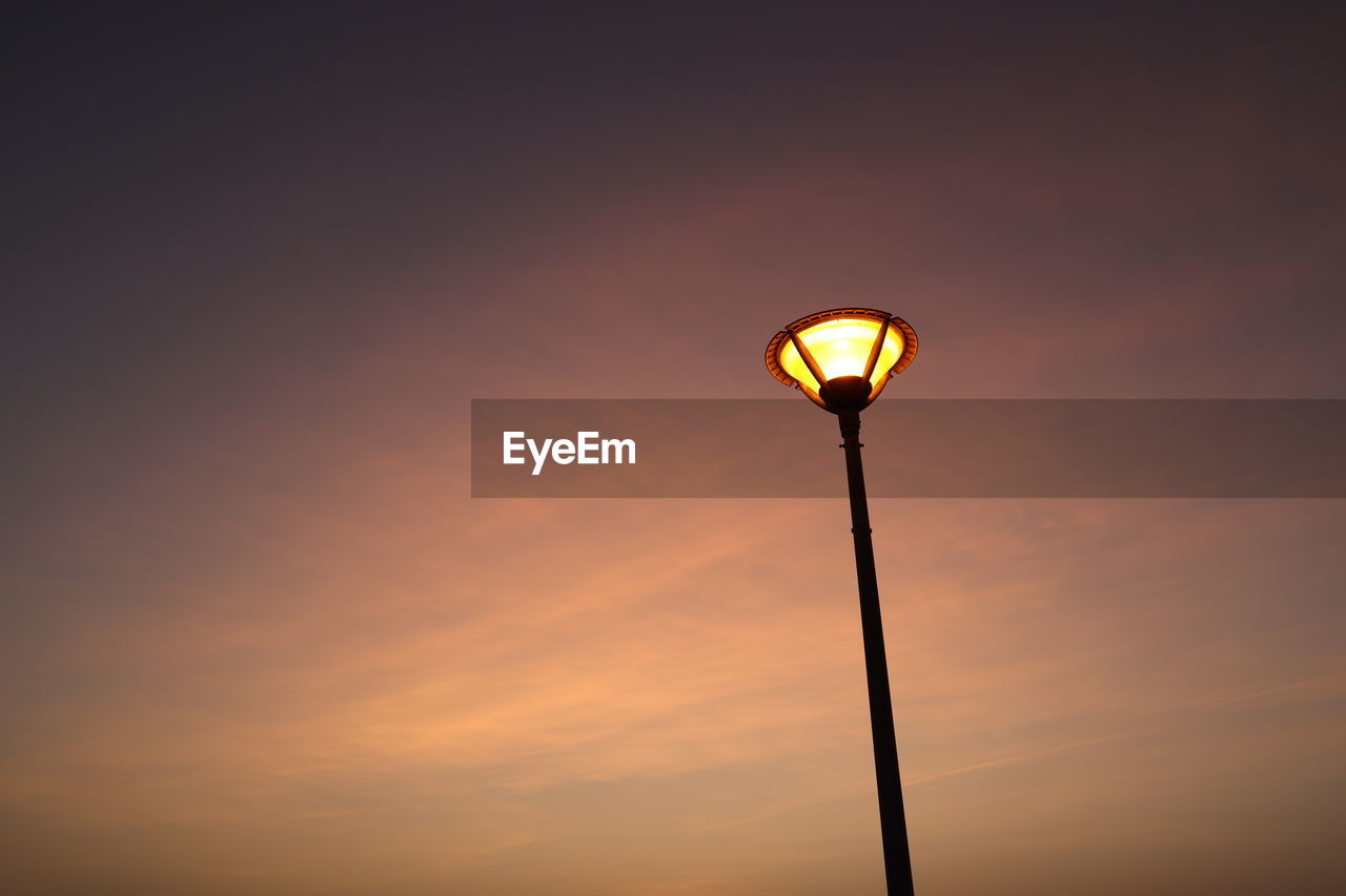 Low angle view of illuminated street light | ID: 142911638