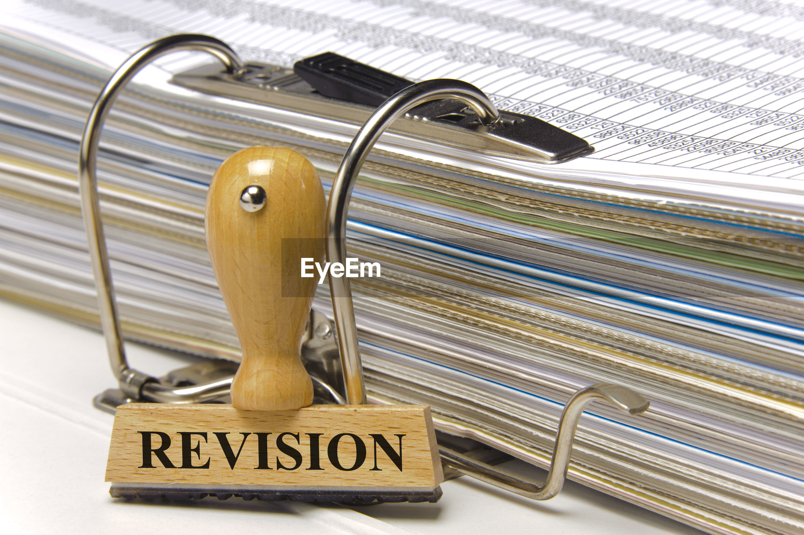 Close-up of revision stamp by documents on | ID: 120410849