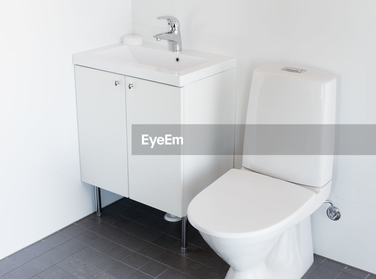 High angle view of toilet bowl by cabinet | ID: 144163757