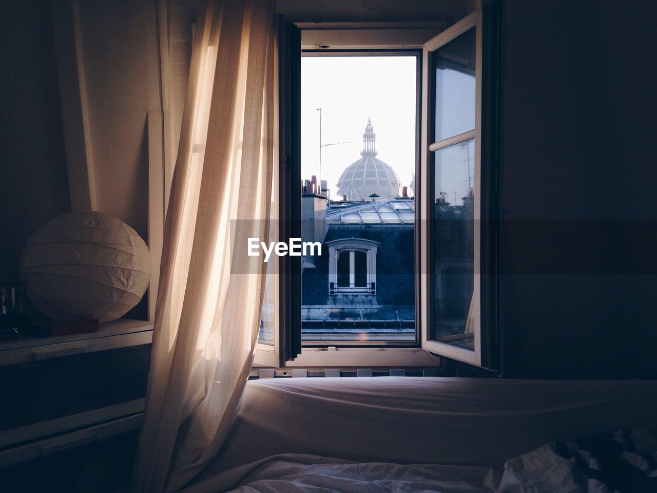 Buildings seen through bedroom window | ID: 58322149