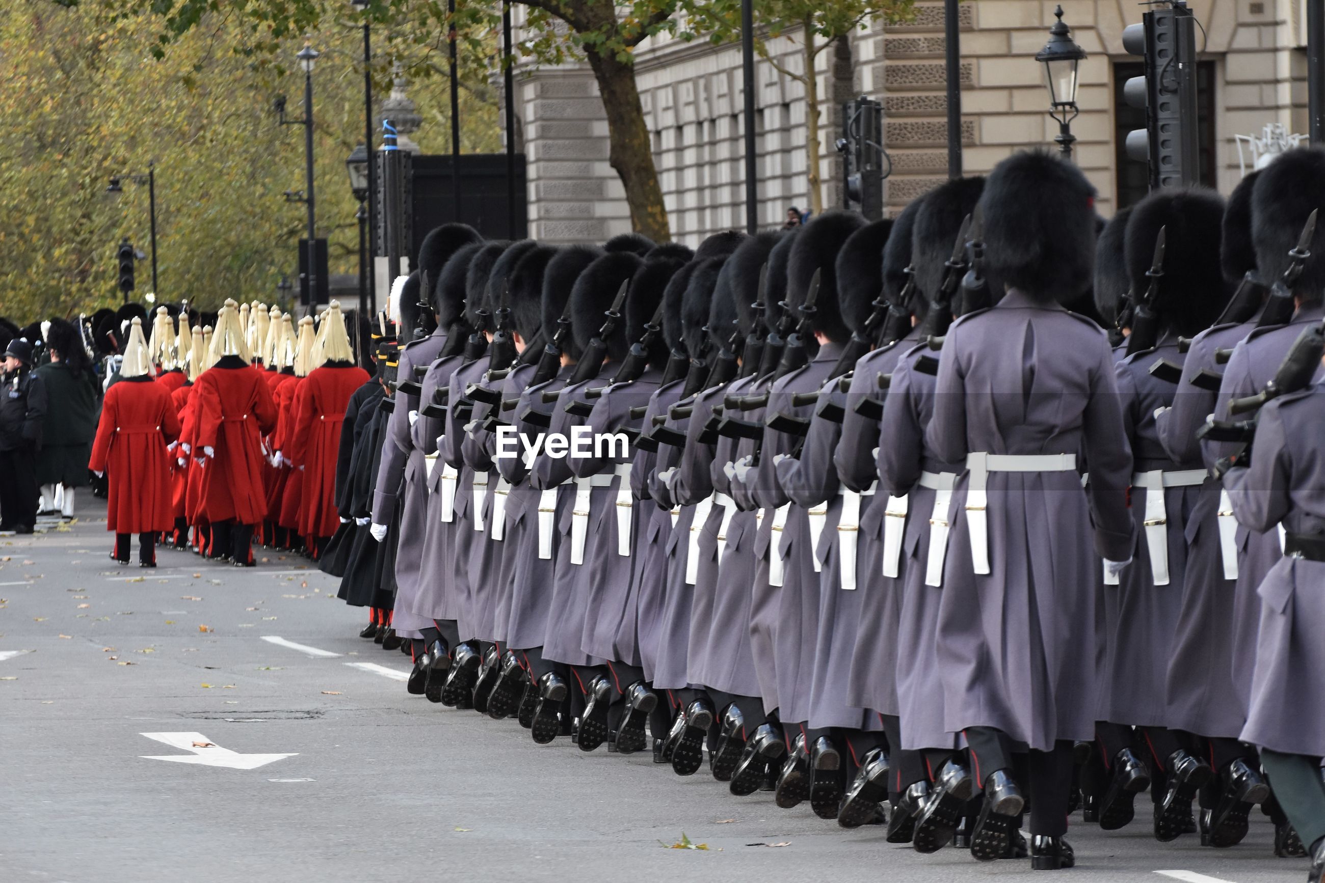 Rear view of people walking in parade on | ID: 114861940