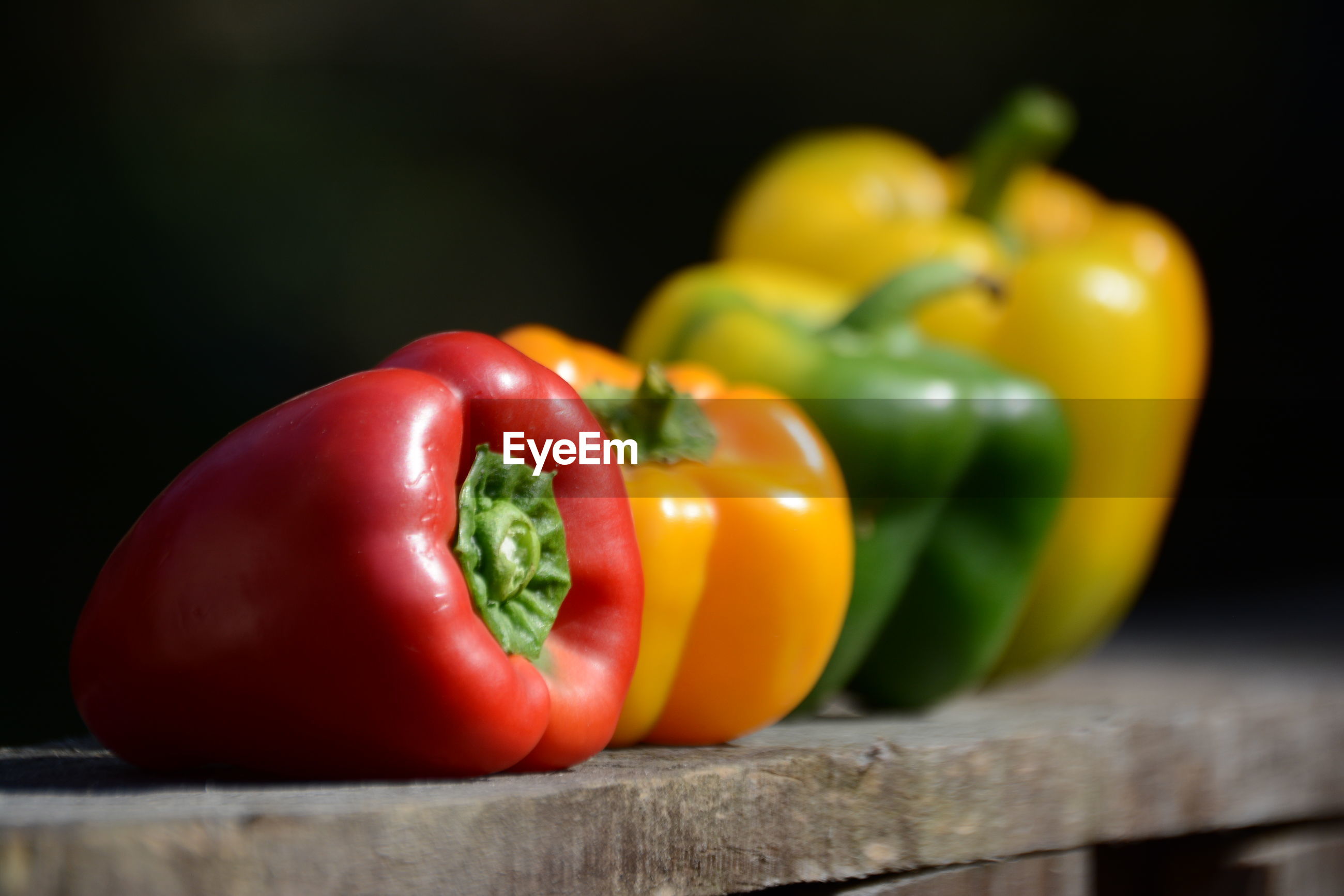 Close-up of various bell peppers on table | ID: 94417027
