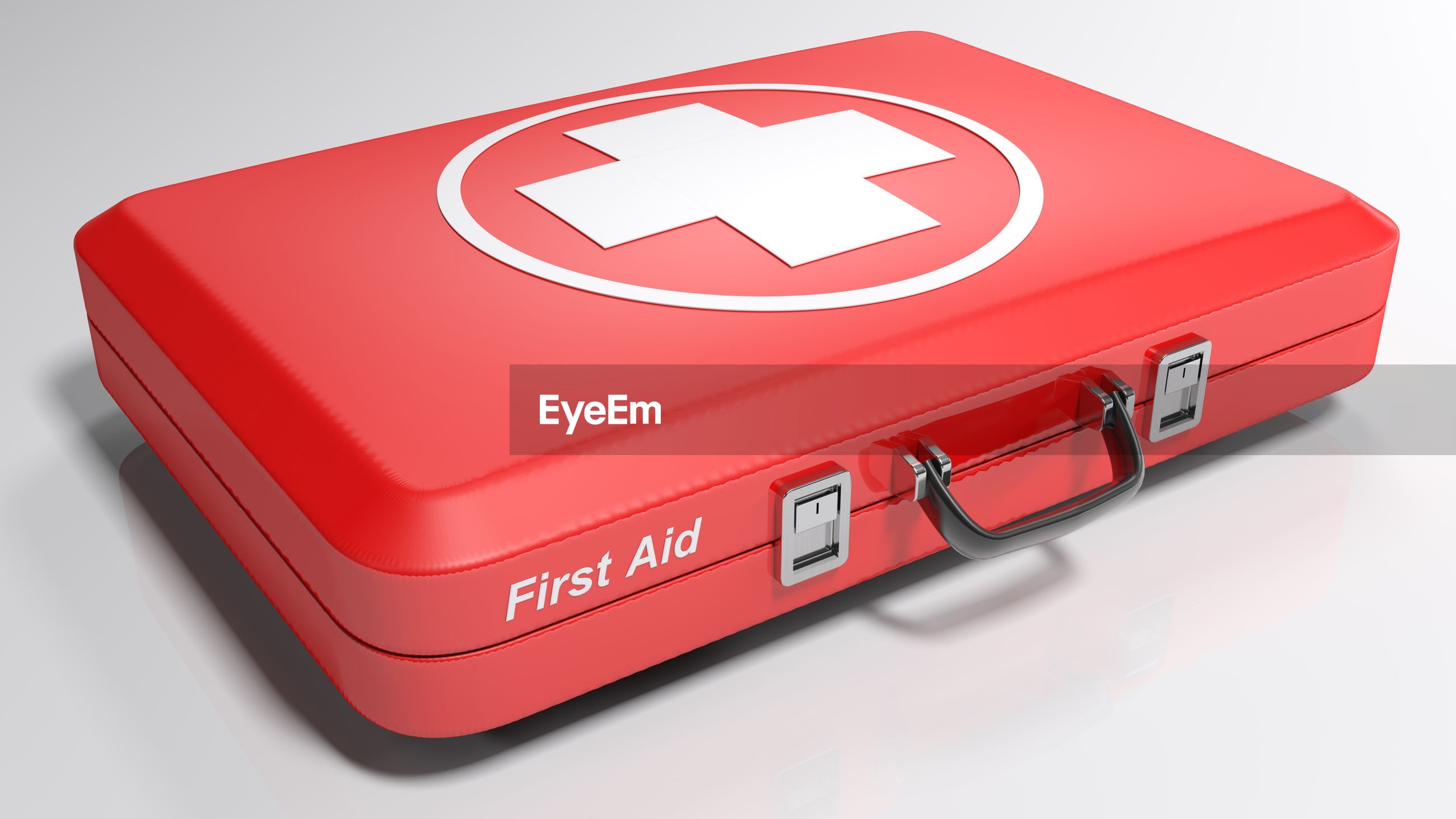 Close-up of first aid kit on gray background | ID: 119558896