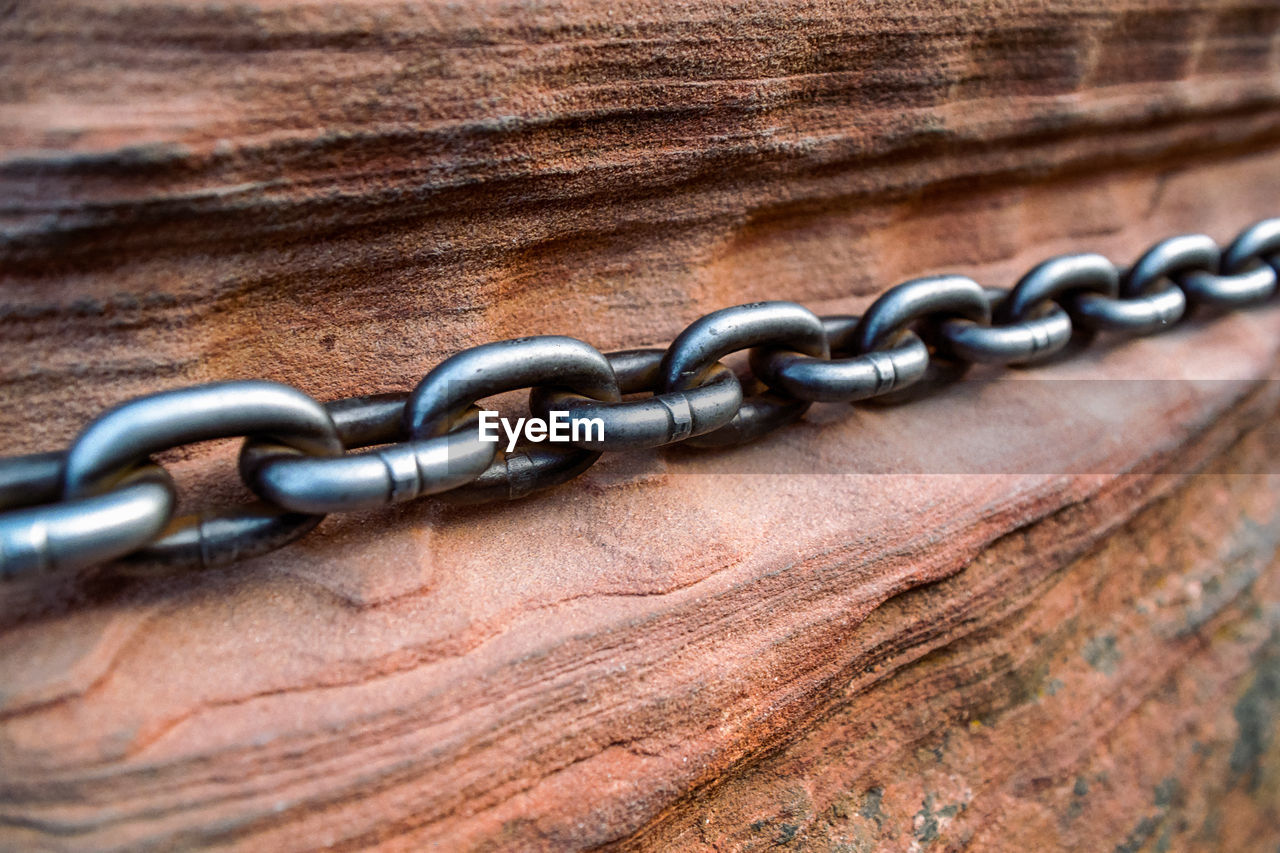 Close-up of chain on rock formation | ID: 138869262